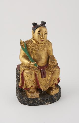 Temple figure of male on a throne | Science Museum Group Collection