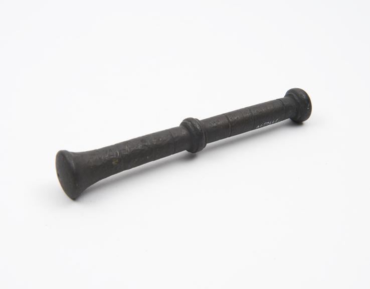 Bronze pestle with trumpet-like grinding end, and tapering stem with ...