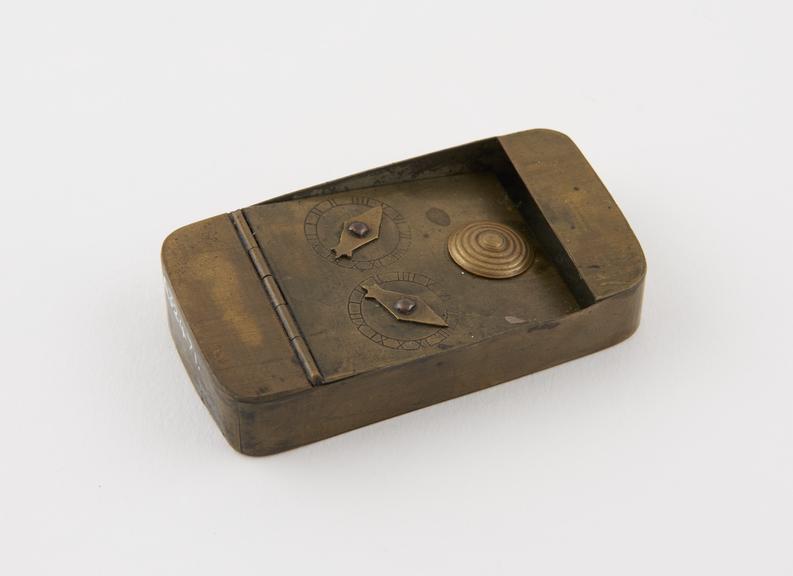 Oblong brass snuff box with hinged lid on broken combination lock in ...