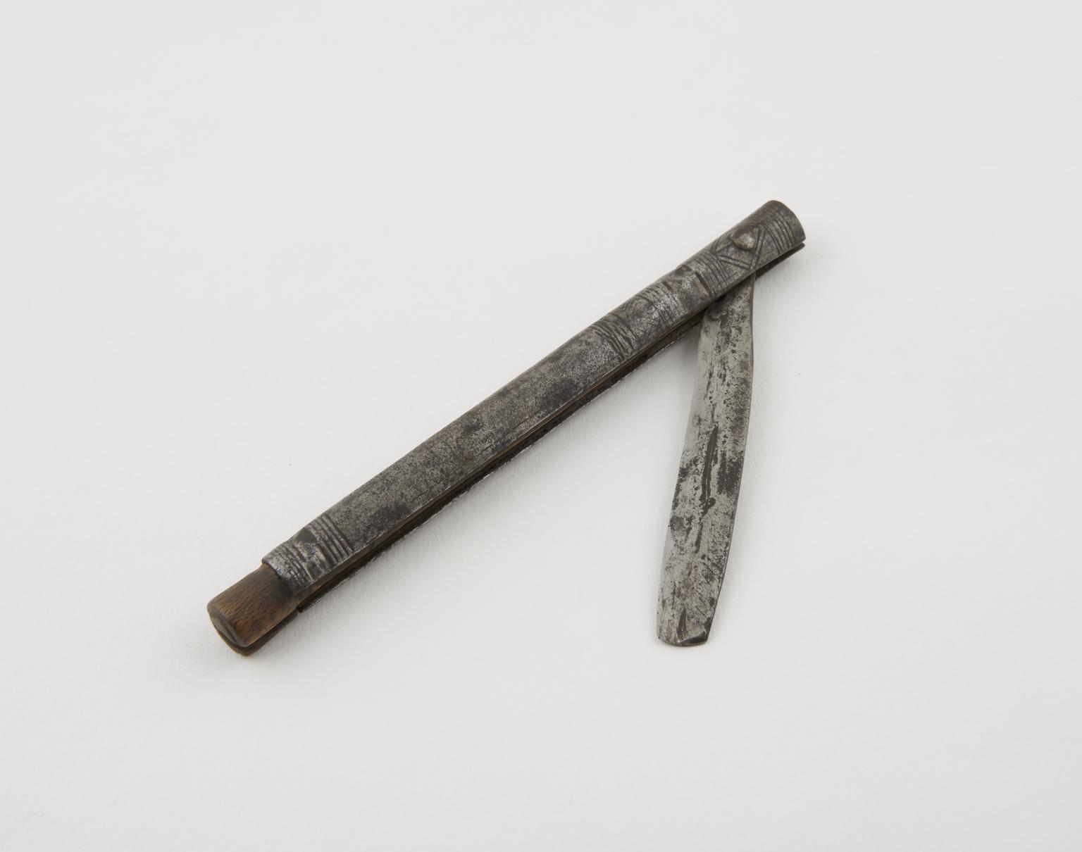 Soft black leather case holding two steel cut-throat razors | Science ...