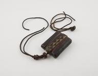 Leather amulet with decorative panel of woven leather and grass ...