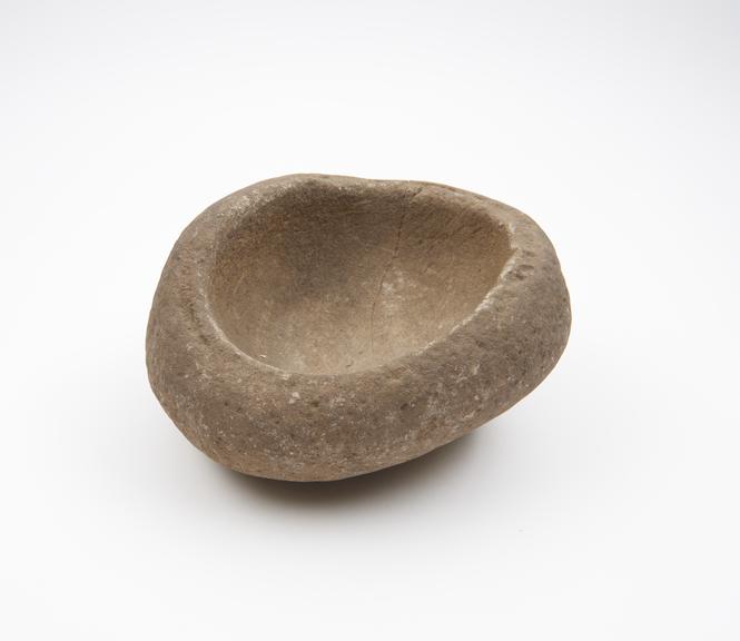 Roughly carved sandstone mortar with uneven hollow and sides | Science ...