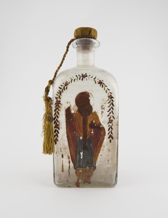Glass bottle with Saint painted on side | Science Museum Group Collection