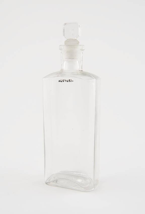 Clear glass rectangular bottle with tall neck and glass stopper ...