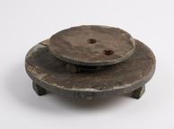 Paper covered lead disc with three feet | Science Museum Group Collection