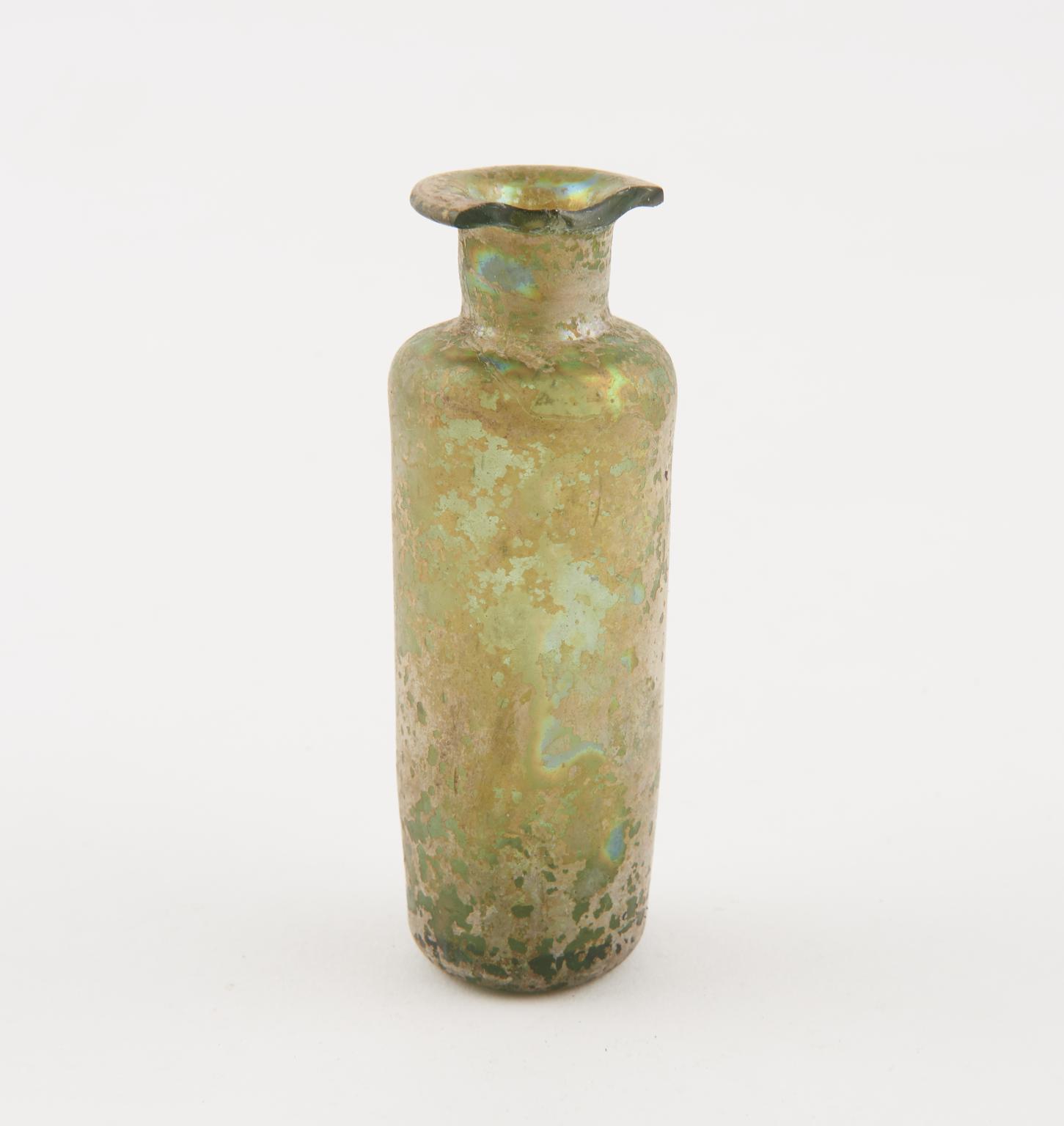 Four glass bottles, cylindrical, iridescent weathering | Science Museum ...