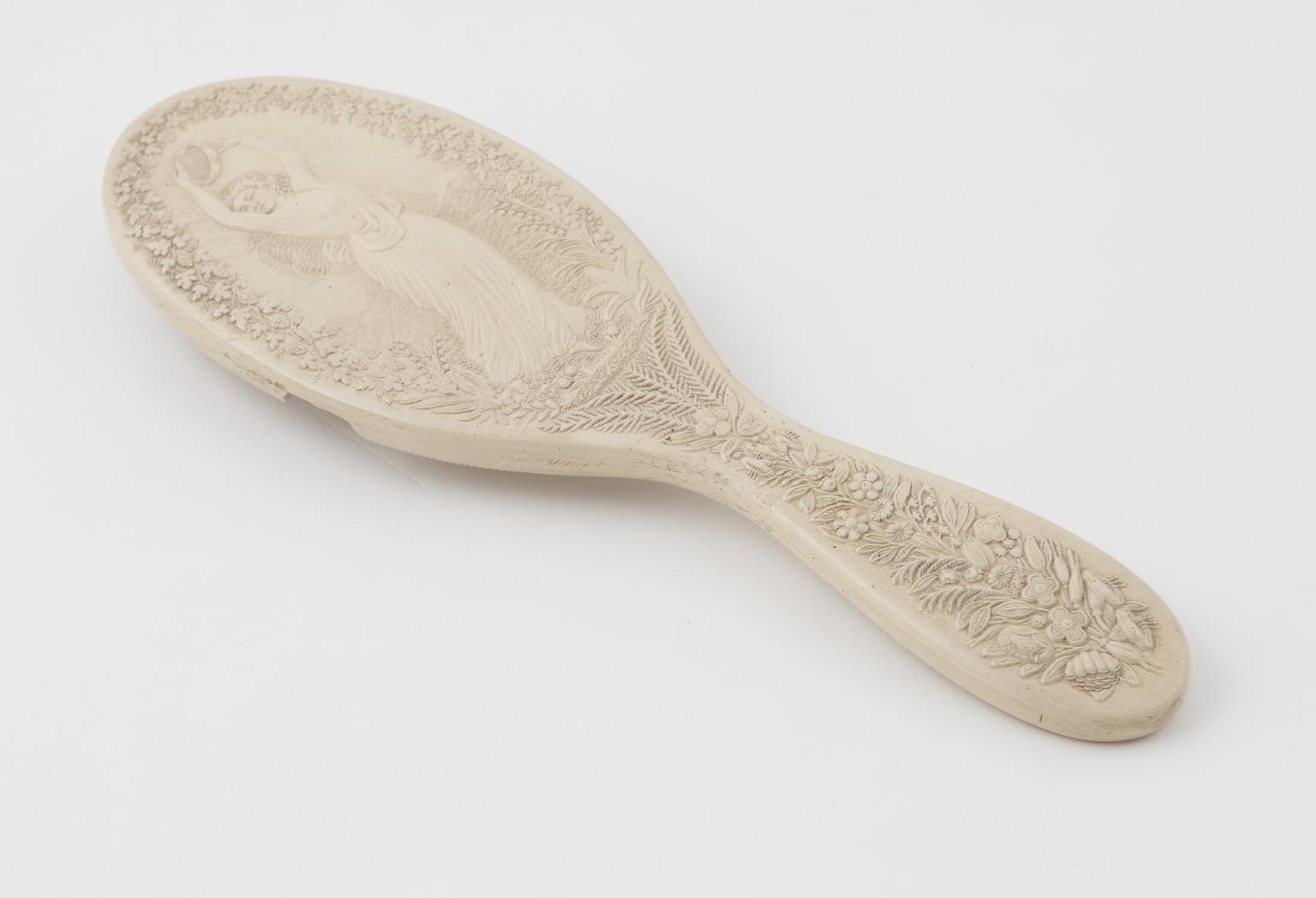 Parkesine brush or mirror with moulded female Grecian figure with ...