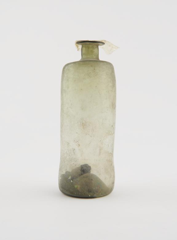 Iridescent pale green glass bottle | Science Museum Group Collection