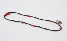 Necklace of tiny black disc-shaped beads | Science Museum Group Collection