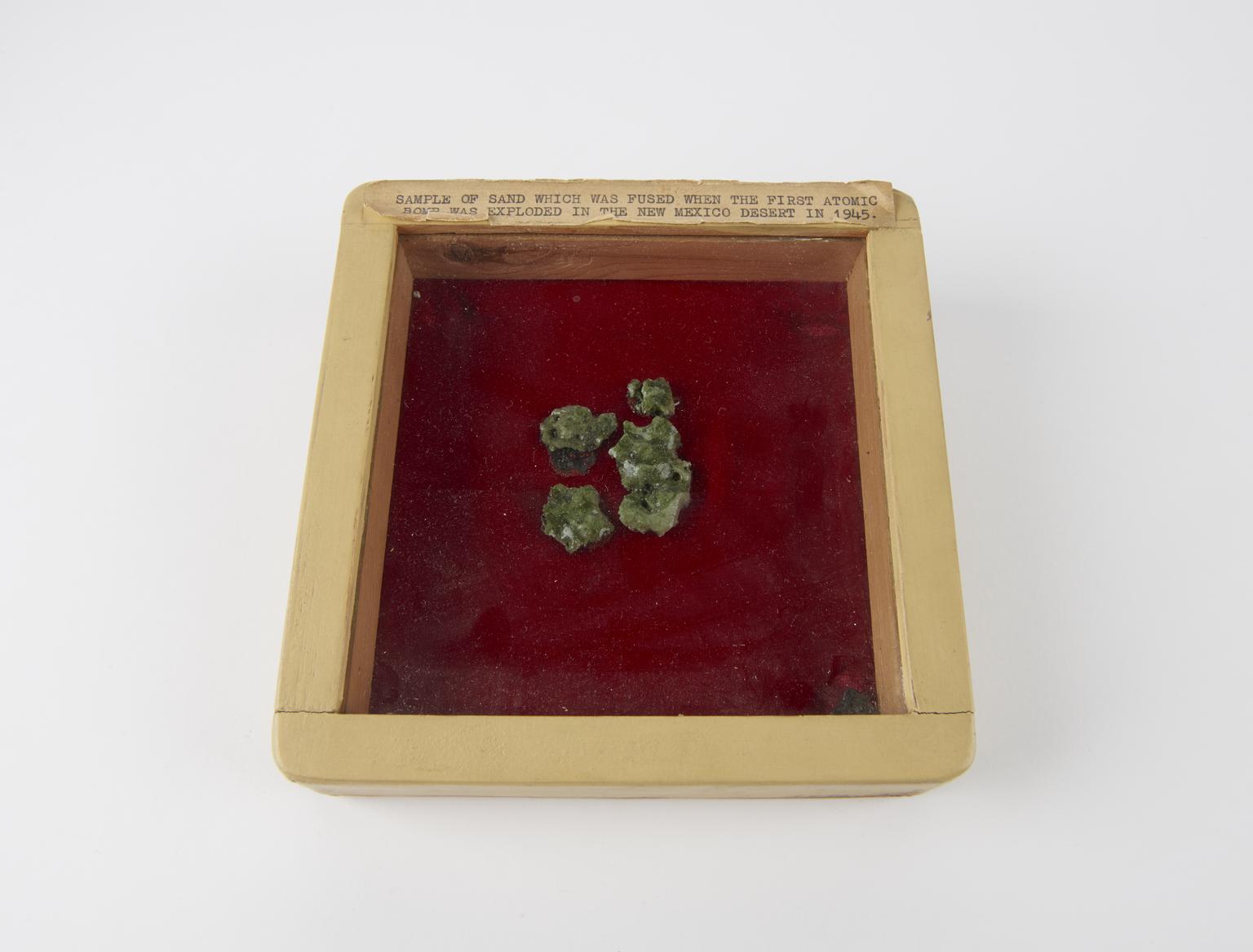 Specimen of sand melted by the explosion of the first test atomic bomb ...