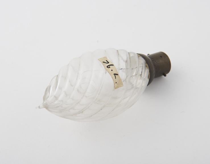 Lamp with moulded twisted glass envelope to simulate a flame effect ...