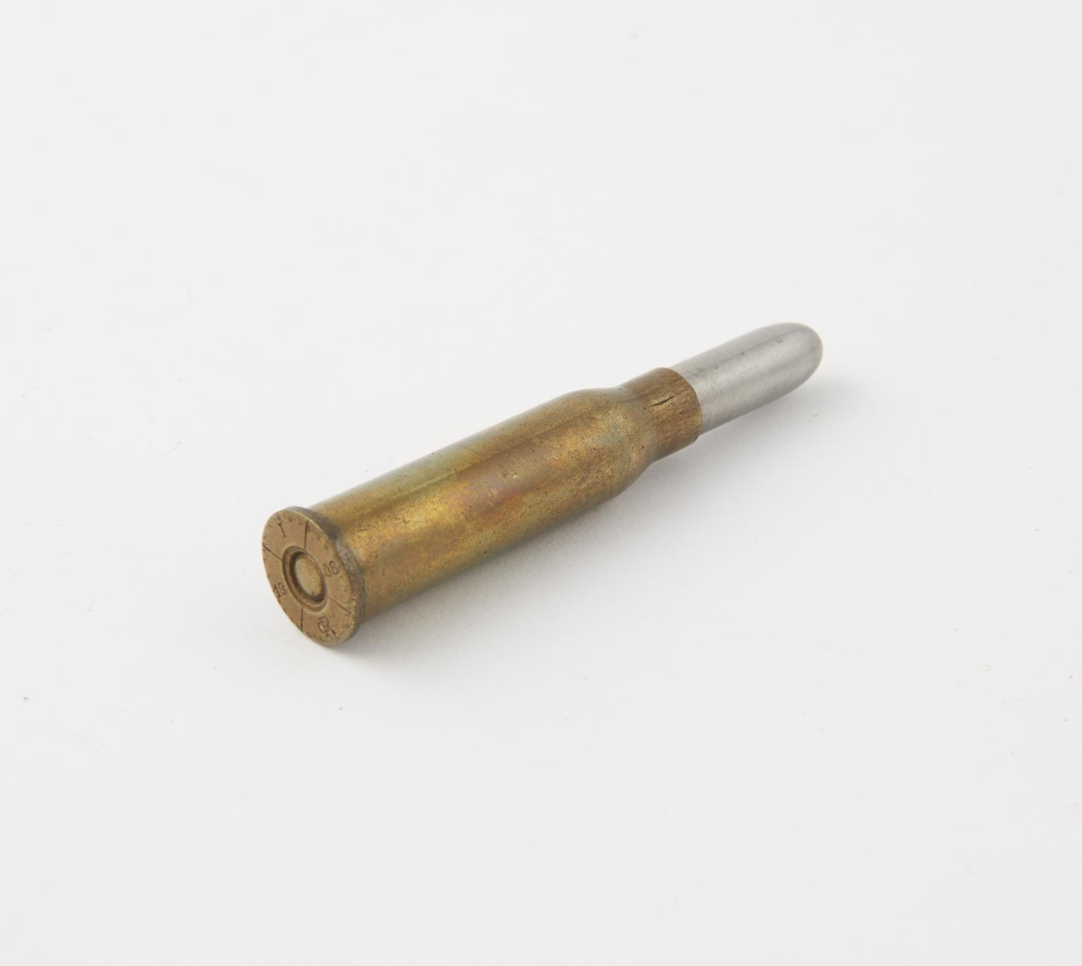 One of three lighters made from German brass rifle-cartridges and ...