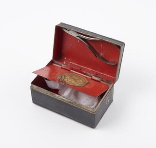 An original Box (length 3 3/4 ins) of tin in which paper-wrapped ...