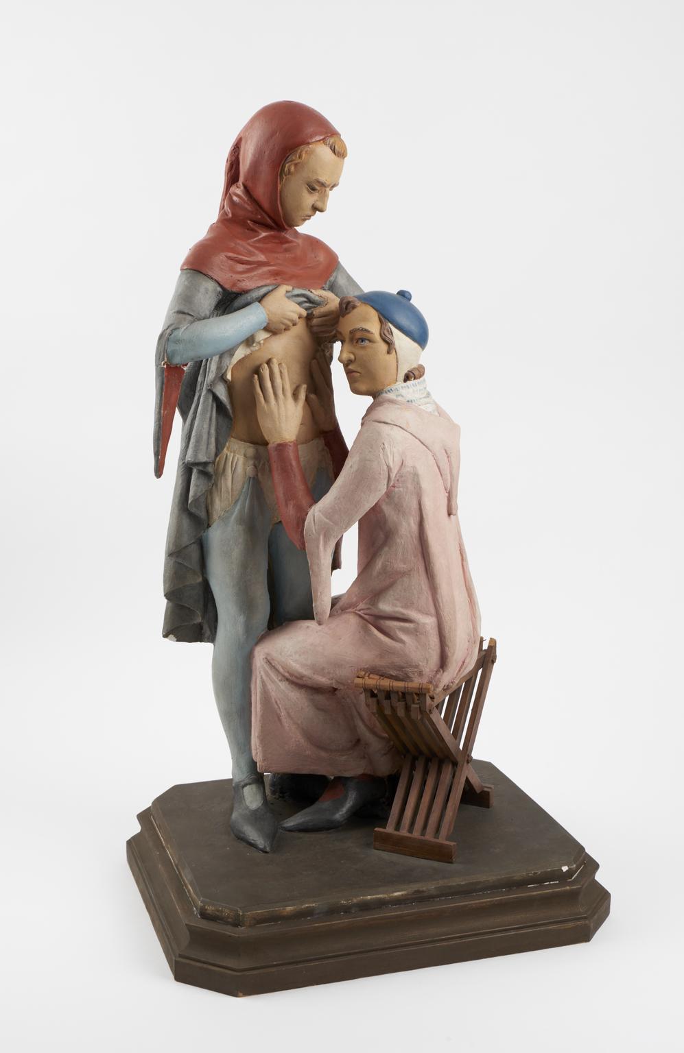 Plaster representation of medieval physical palpating a patient ...