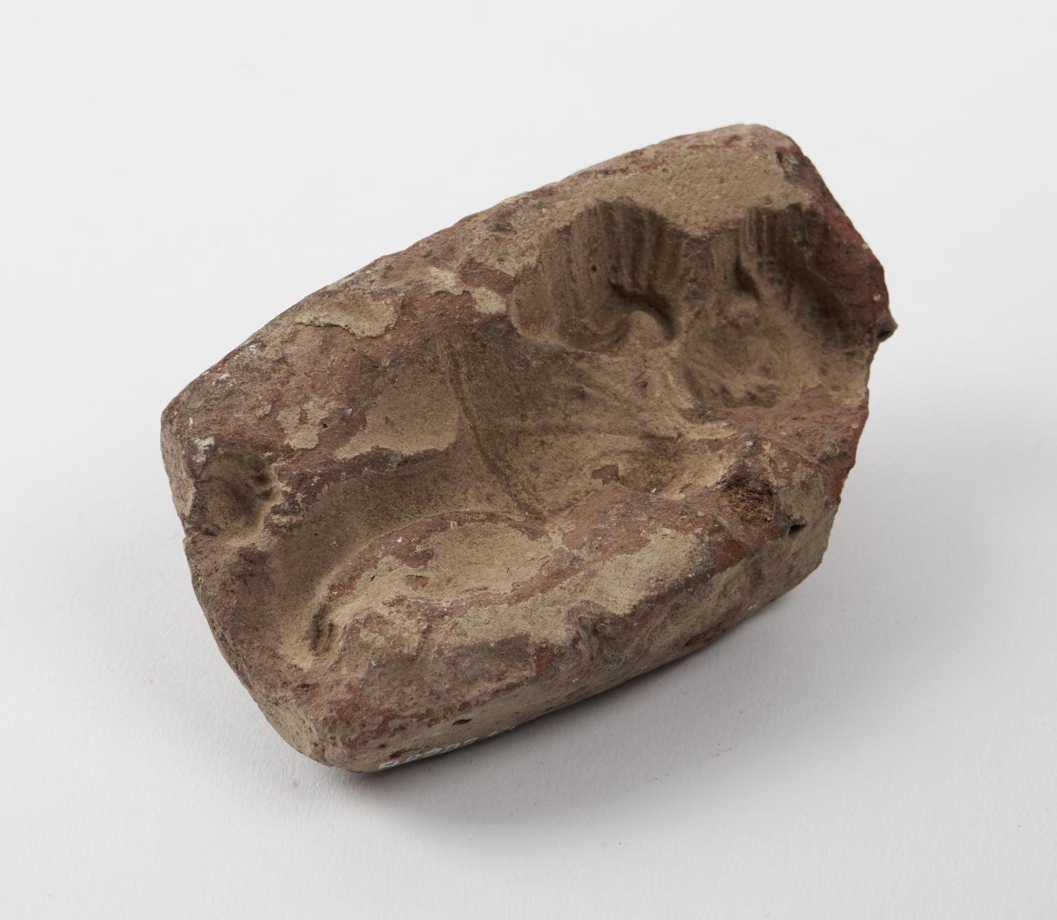 Front panel of red clay mould for phallic figure | Science Museum Group ...