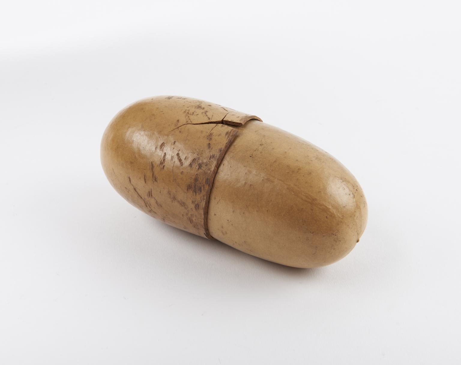 Tinder-box made from shells of two half-gourds, with flint, steel, and ...