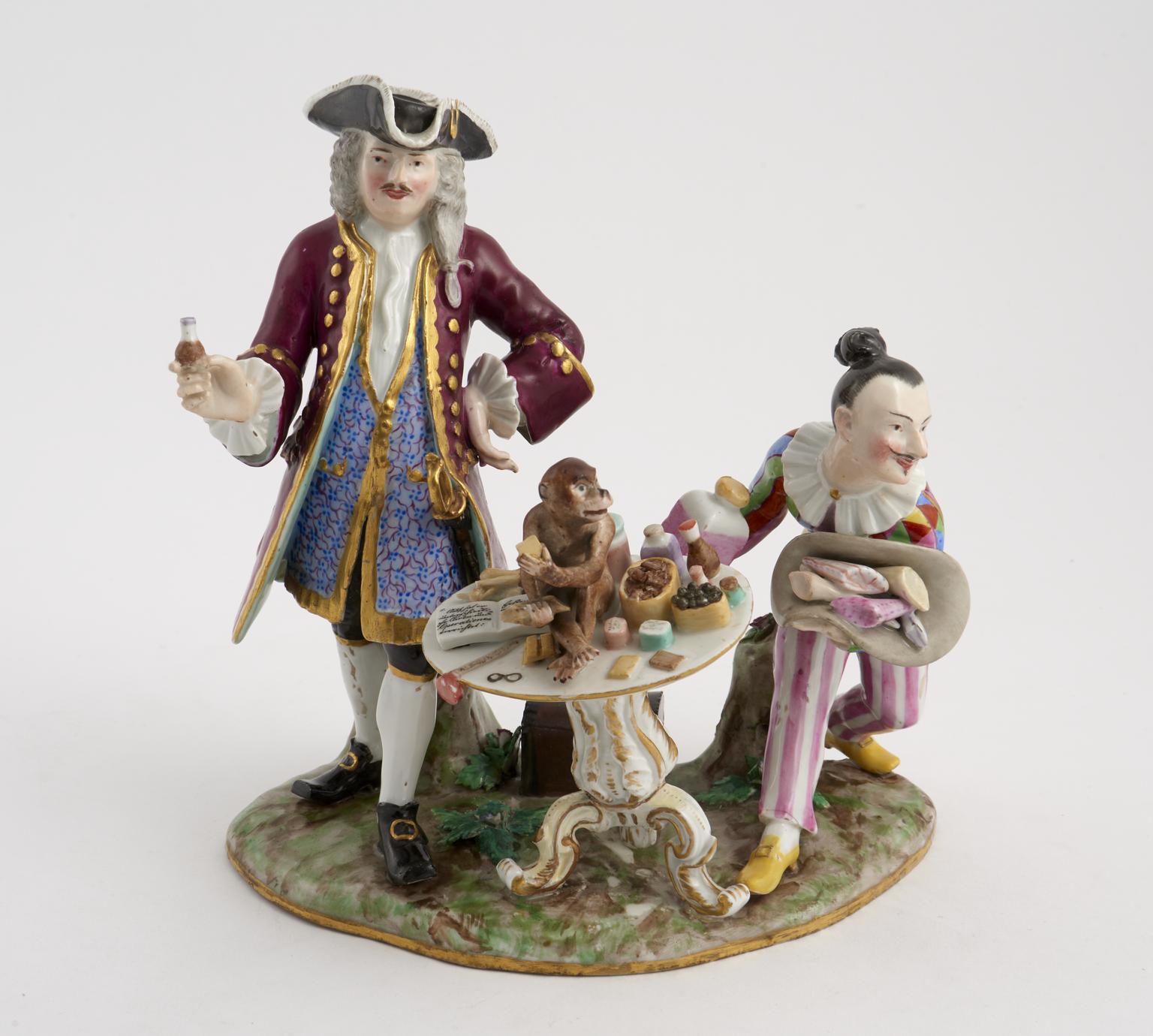 Porcelain figure group showing a seller of quack medical treatments ...