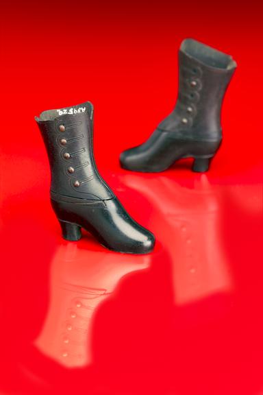 Two snuff boxes shaped like a pair of lady's boots in ebony and horn ...