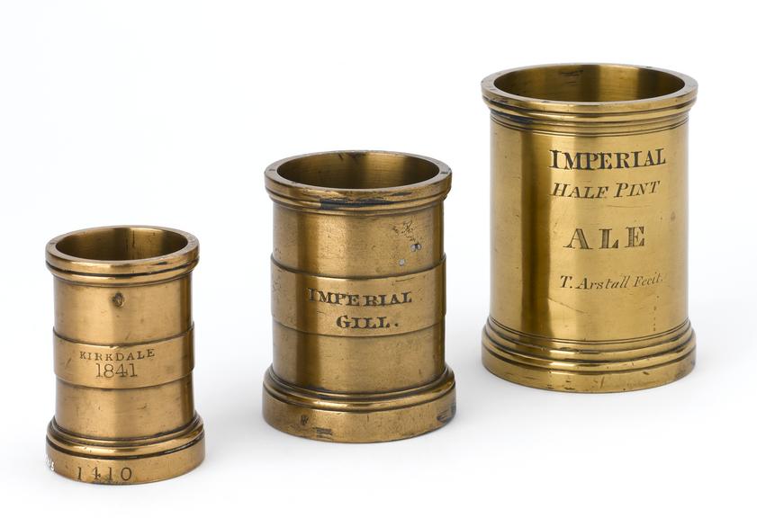 Set of five Lancashire (Local) cylindrical bronze ale standard measures ...