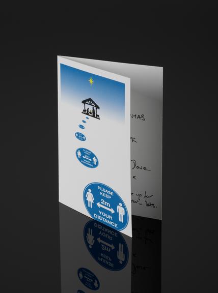 Christmas card showing social distancing markers leading up to a manger ...