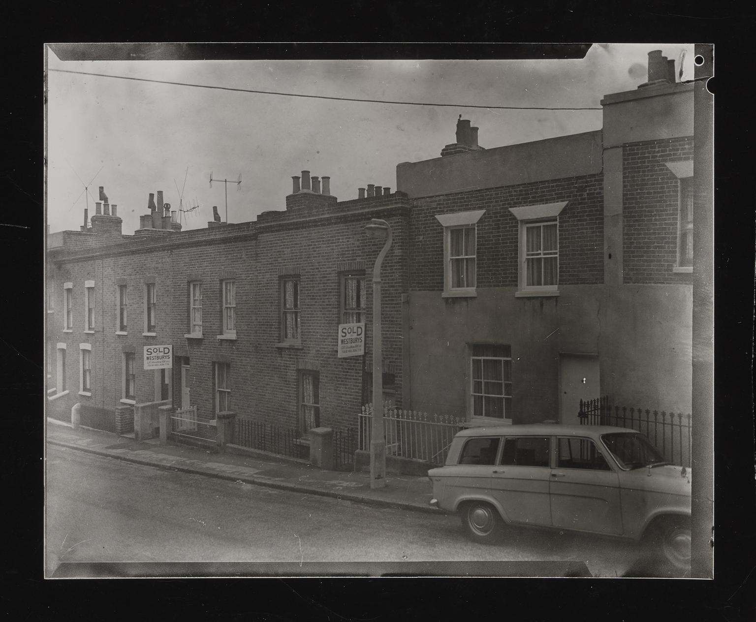 A photographic print of Home & Housing, Post War, Slums & Living ...