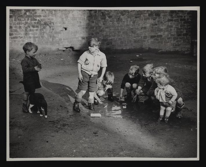 A photographic print of Home & Housing, Post War, Slums & Living ...