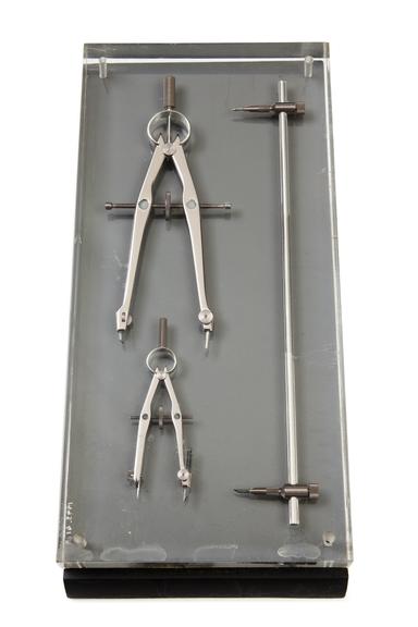 Set of compasses set into a plastic block made by British Thornton Ltd ...
