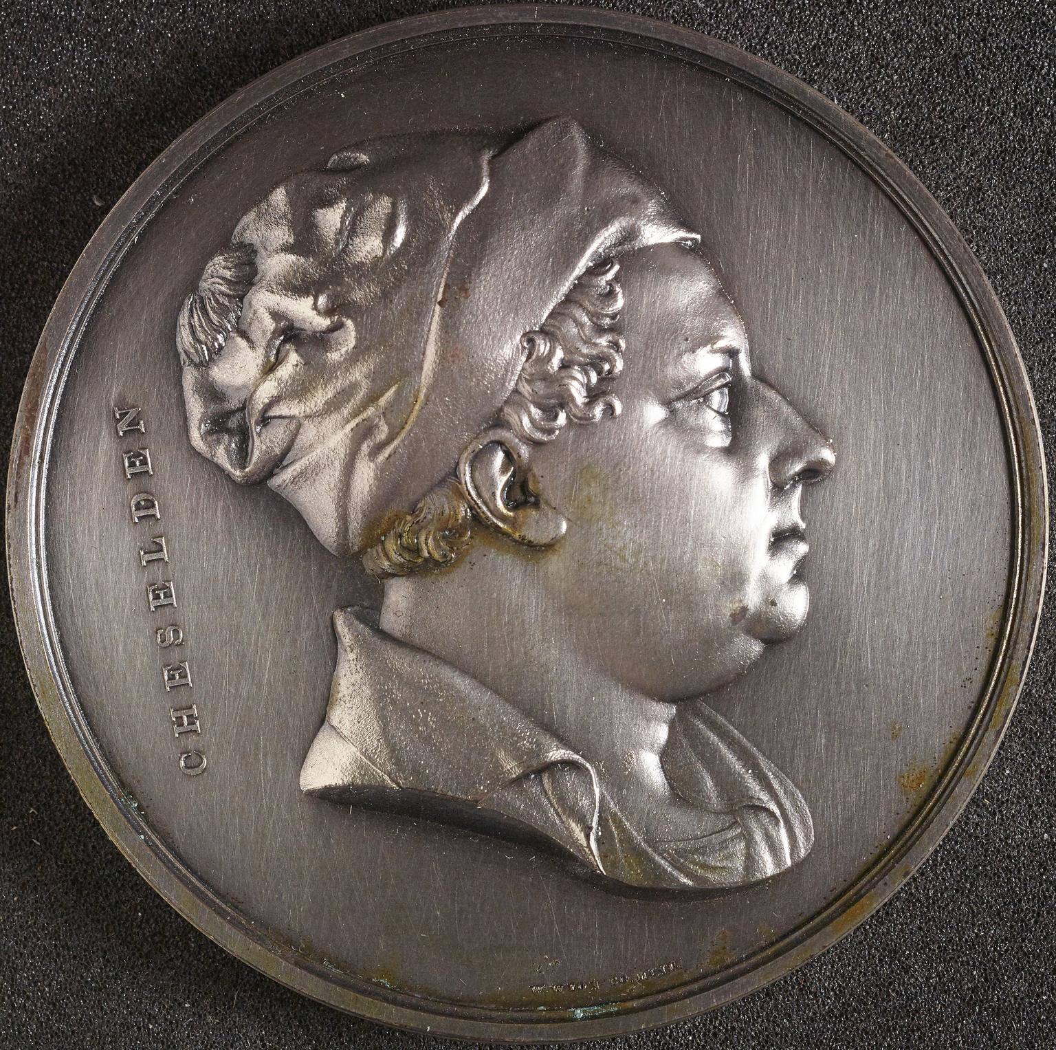 Circular white metal medal | Science Museum Group Collection