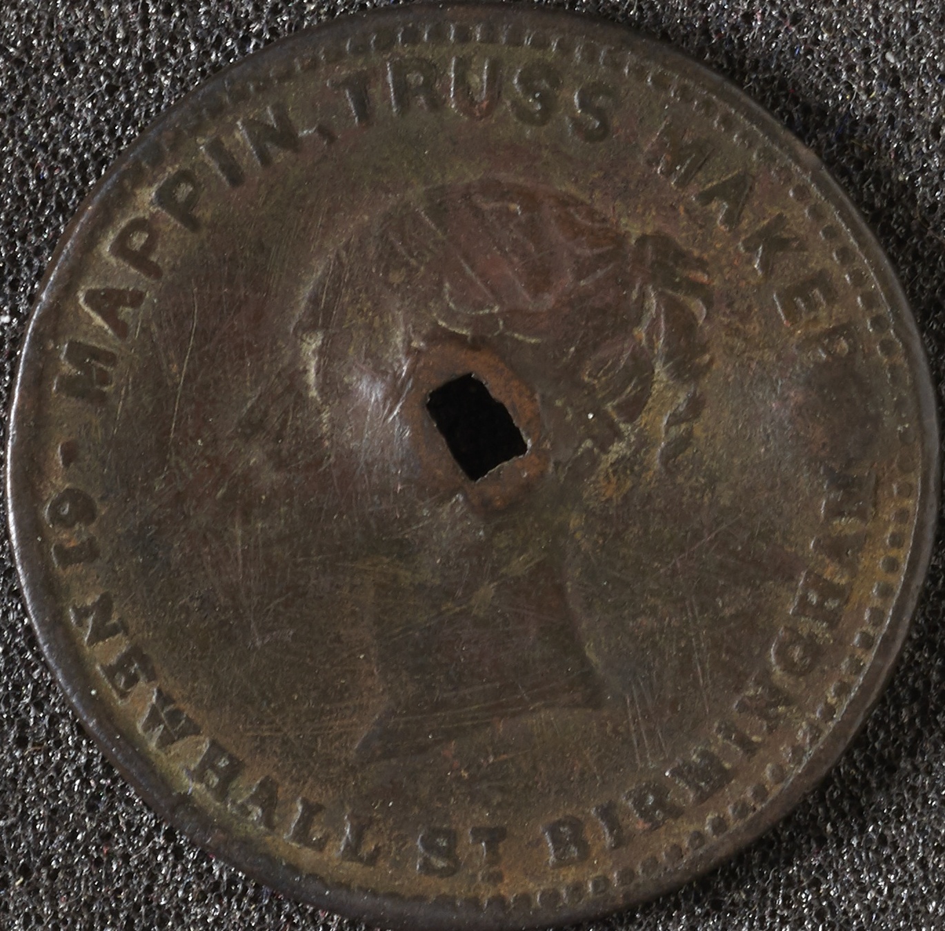 Circular copper token with hole punched through middle | Science Museum ...