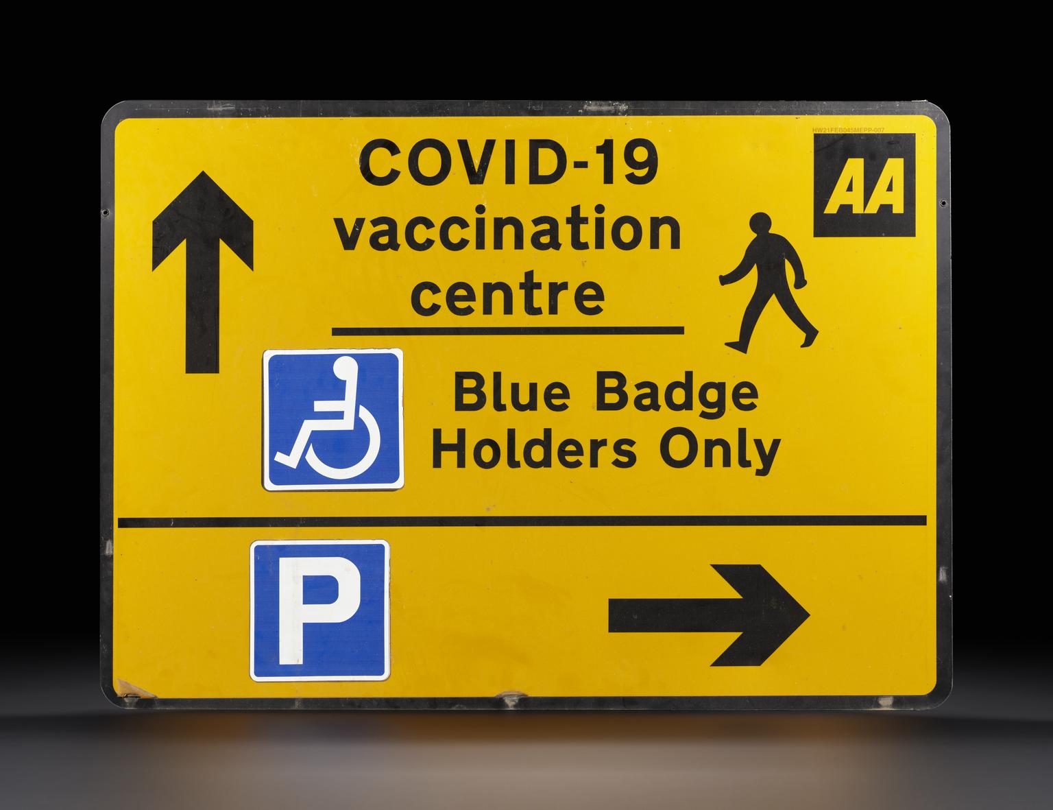 Road sign directing people to their COVID-19 vaccination | Science ...