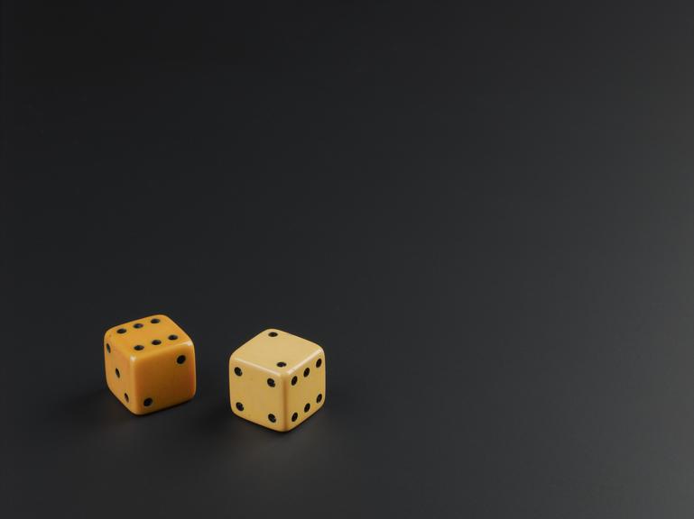 Pair of dice made of ivory cellulose nitrate with black markings ...