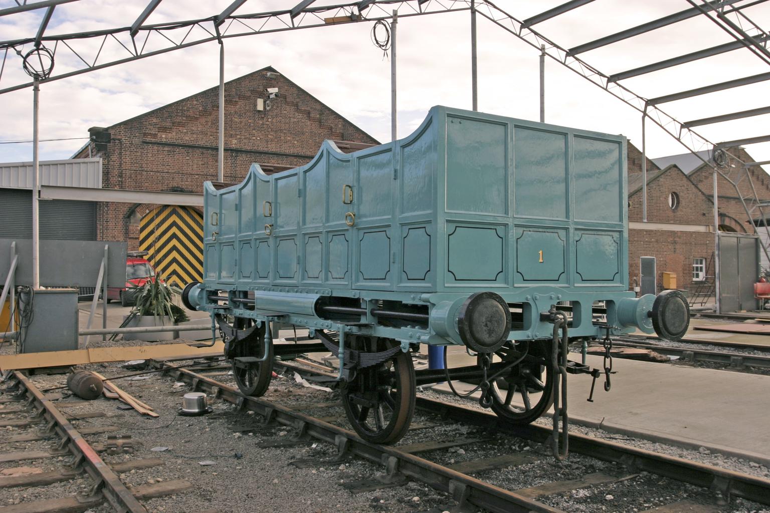 Replica of Liverpool & Manchester Railway 2nd class open-topped railway ...